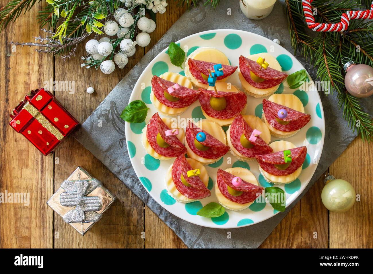 Festive snack of canapes on the Christmas table. Canapes with bread ...