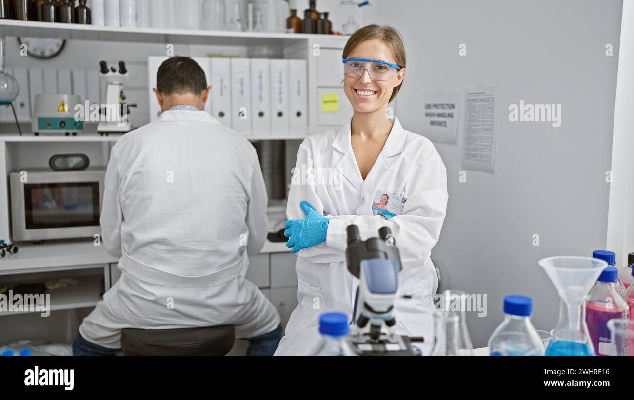 Two amiable scientists, best mates, sitting with arms crossed ...