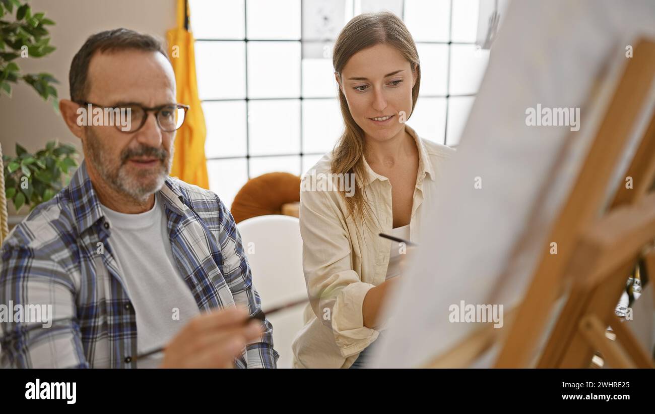 Two smiling artists confidently drawing together in art studio, a happy ...