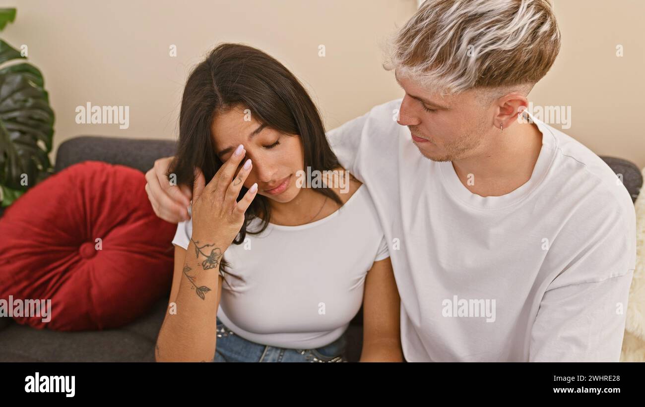 Woman comforts man hi-res stock photography and images - Alamy