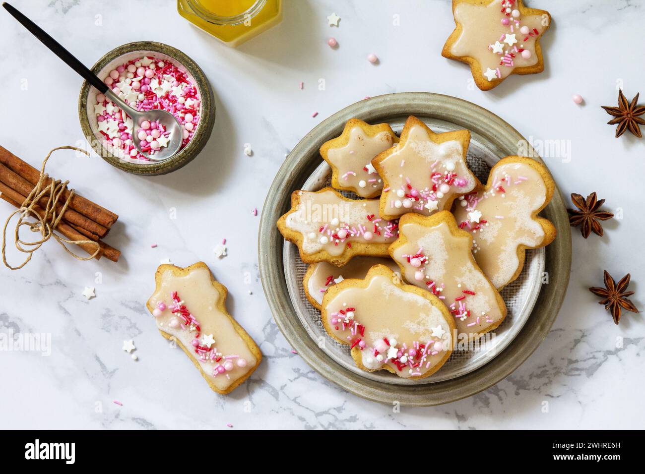 Homemade baking. Gingerbread cookies with glaze on a marble countertop ...
