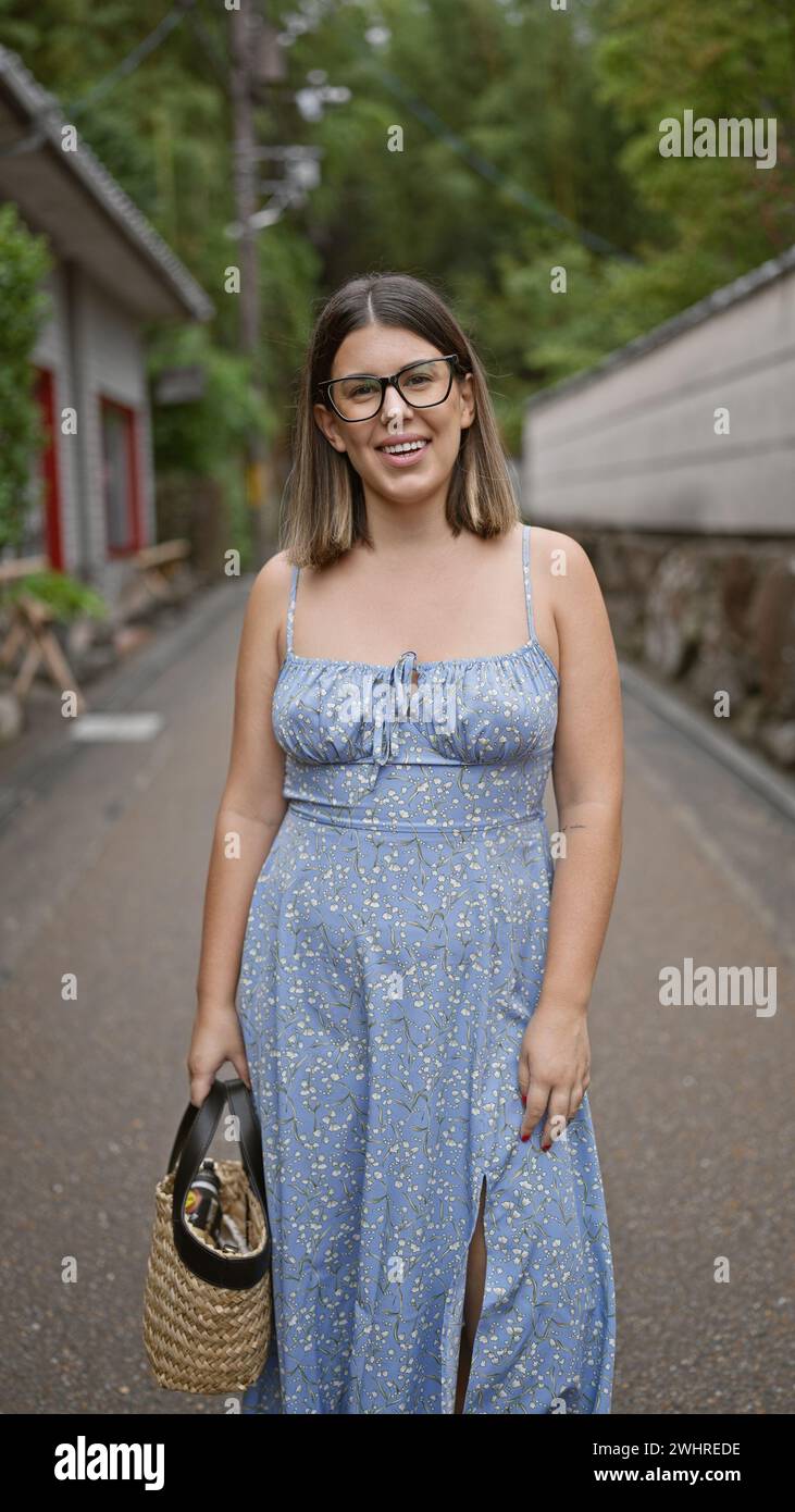Confident hispanic woman, beautiful and joyful, cheerfully posing with ...