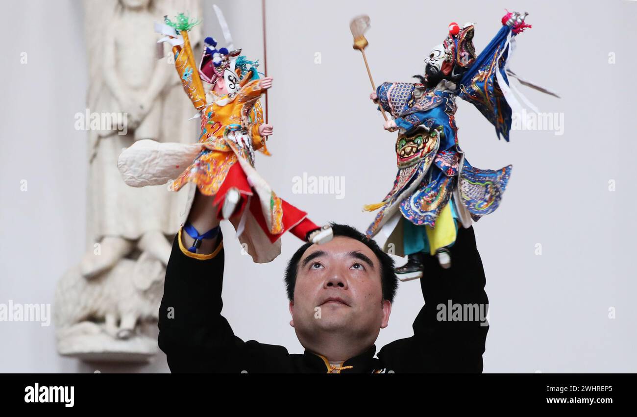 Paris, France. 10th Feb, 2024. An artist of Zhangzhou Puppet Troupe ...
