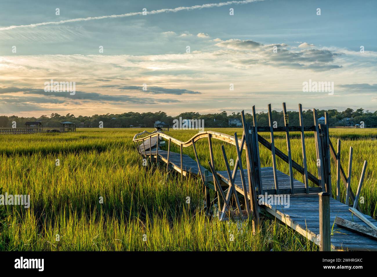 Old dilapidated wooden dock in the marshgrass and inlet of Palweys ...