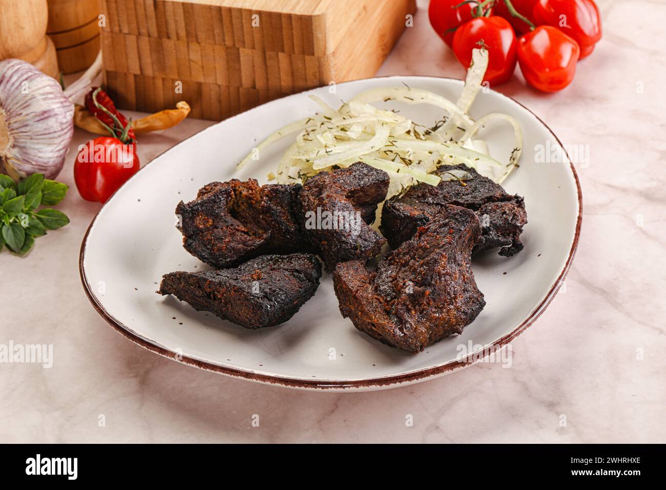 Grilled beef barbecue served onion rings Stock Photo - Alamy