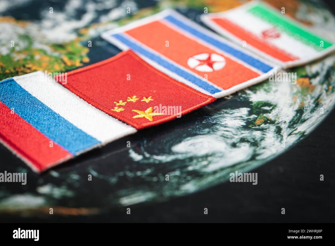 Symbols of Russia, China, North Korea and Iran against the background ...