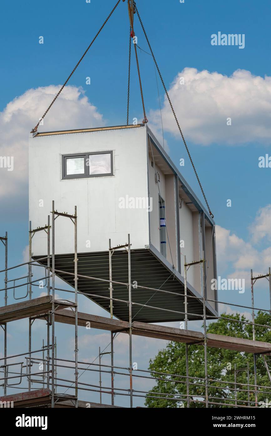 Delivery of a residential container by crane Stock Photo - Alamy