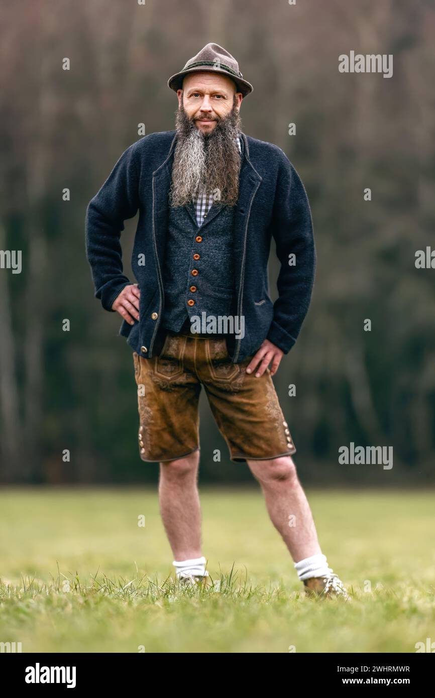 Portrait of a bavarian man wearing a traditional folk costume outdoors ...