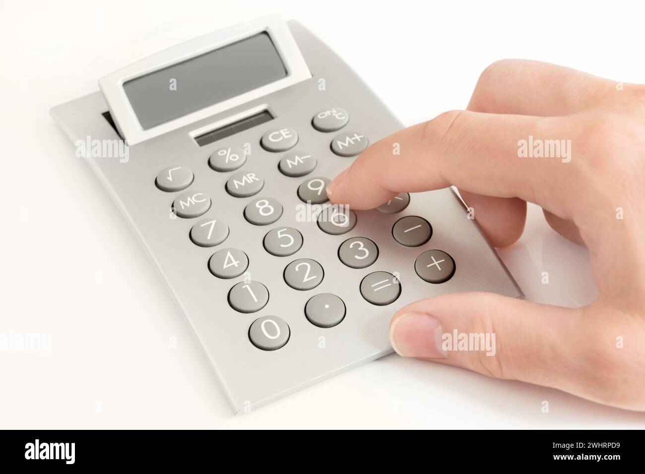 Male hand and calculator on white background Stock Photo - Alamy