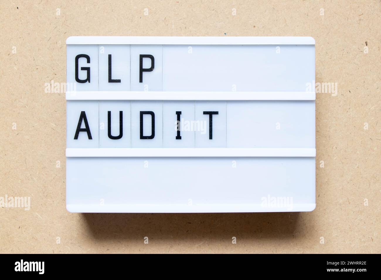 Lightbox with word GLP (Abbreviation of Good laboratory practice) audit ...