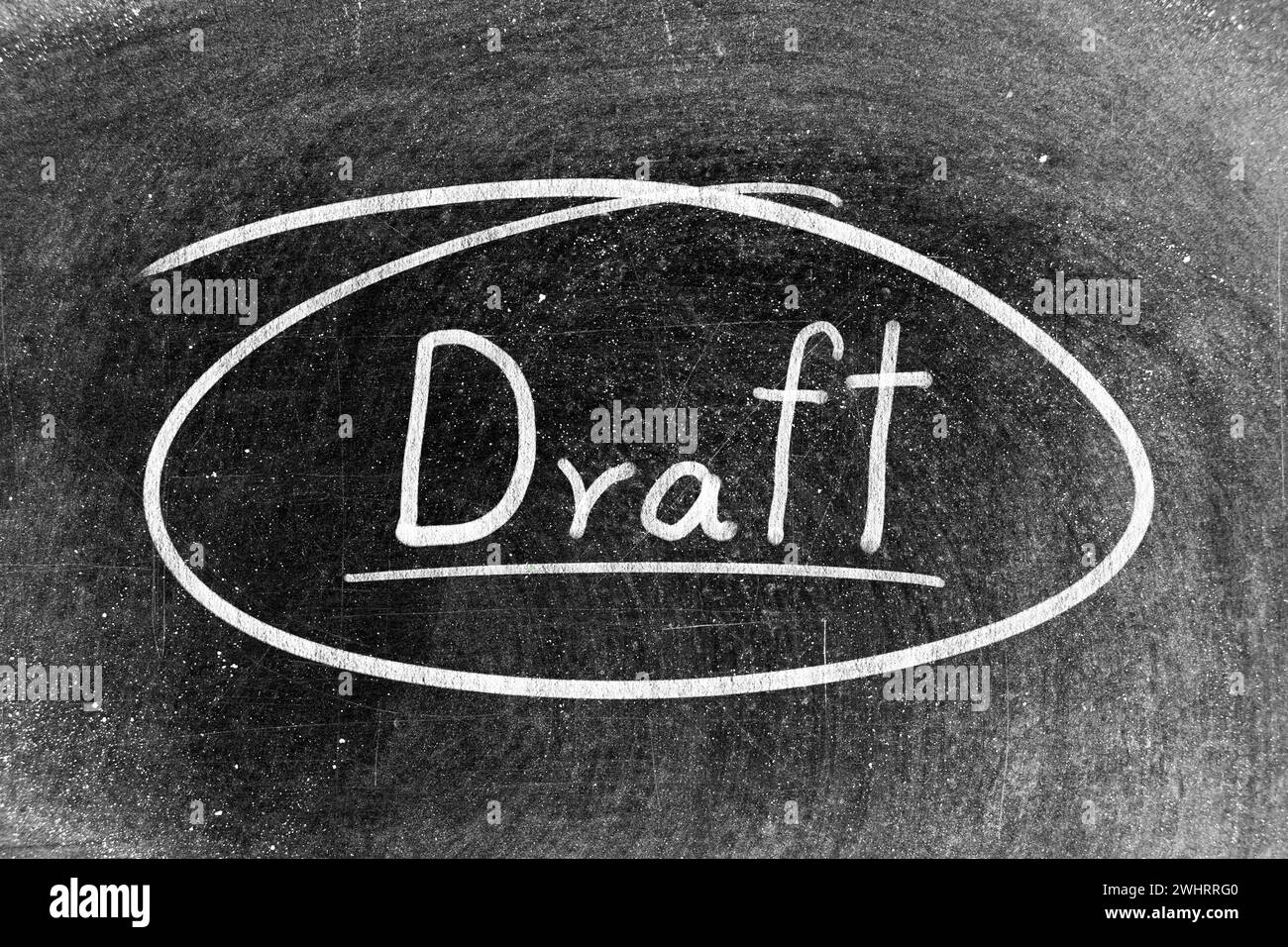 White chalk hand writing in word draft and circle shape on blackboard ...