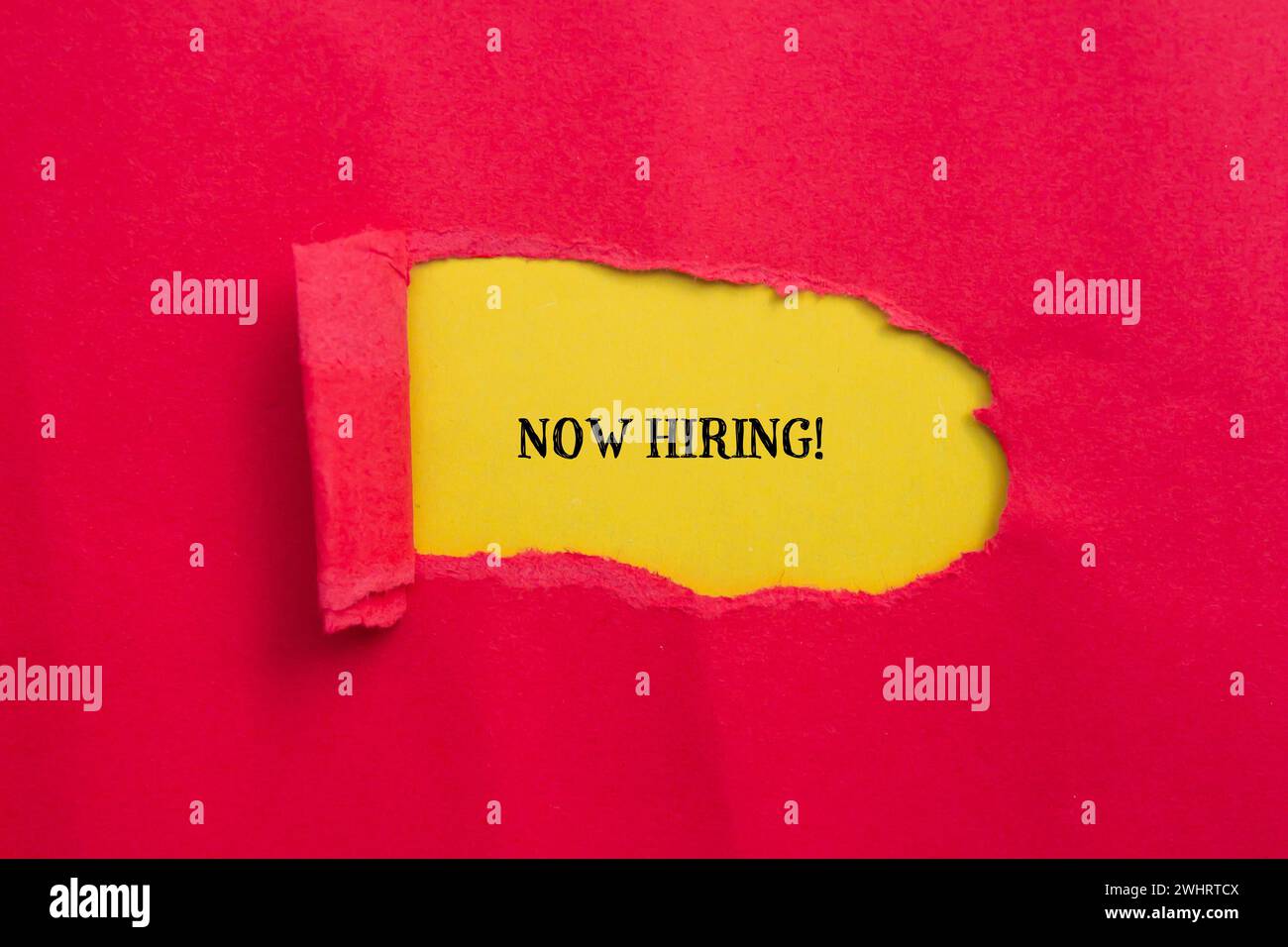Now hiring lettering on torn red paper with yellow background ...
