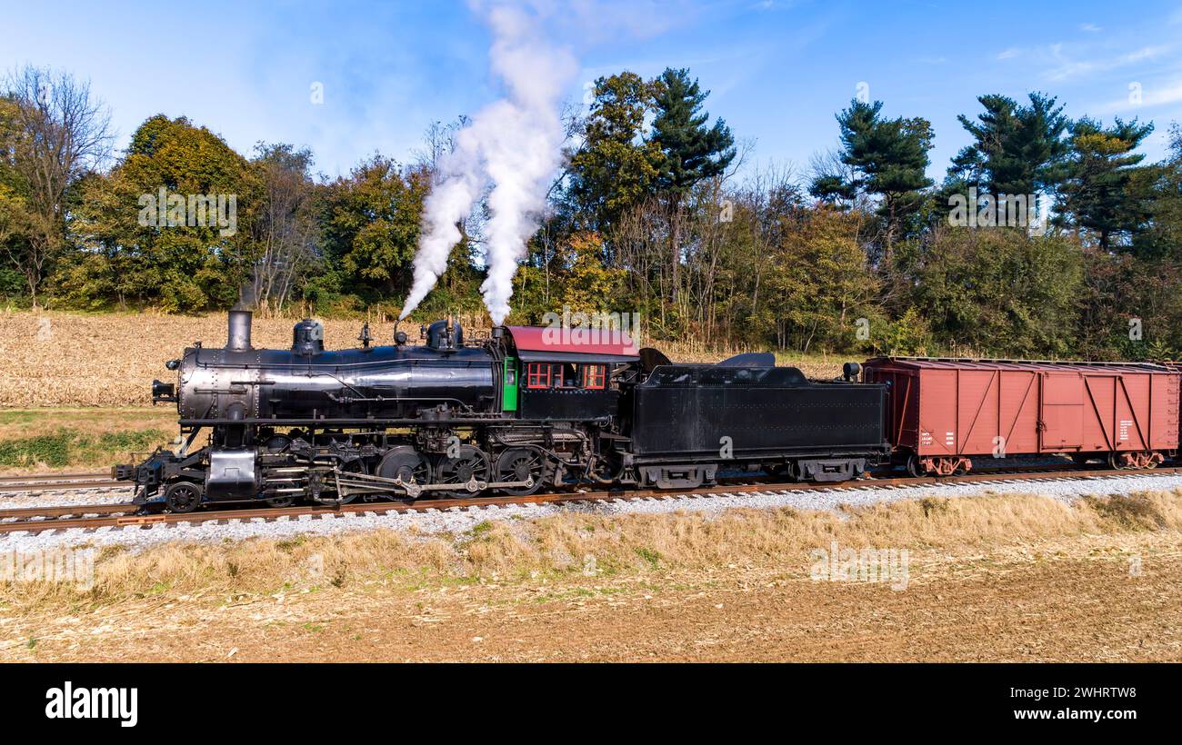 Aerial View of an Antique Steam Freight Passenger Train Blowing Smoke ...