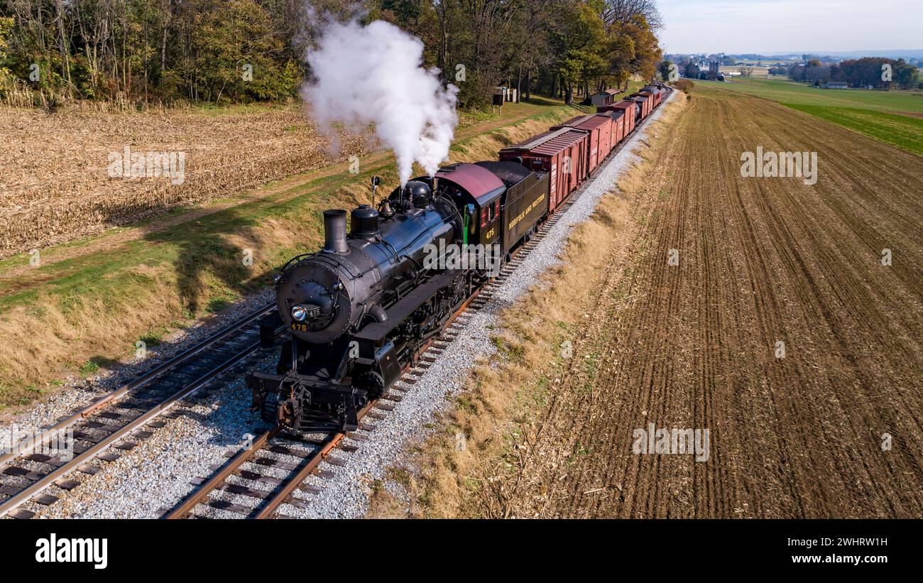 Aerial View of an Antique Steam Freight Passenger Train Blowing Smoke ...