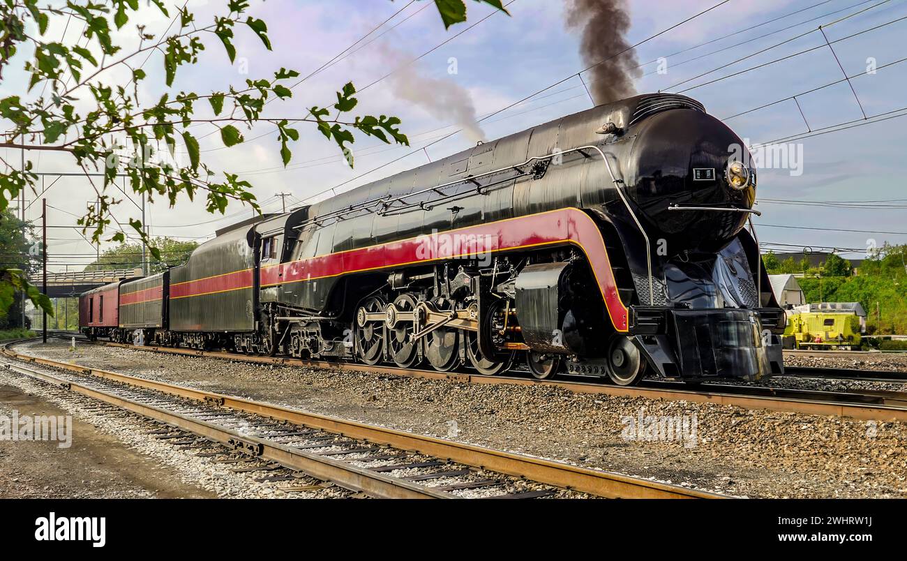 A Restored Steam Locomotive Blowing Black Smoke Arriving at the ...
