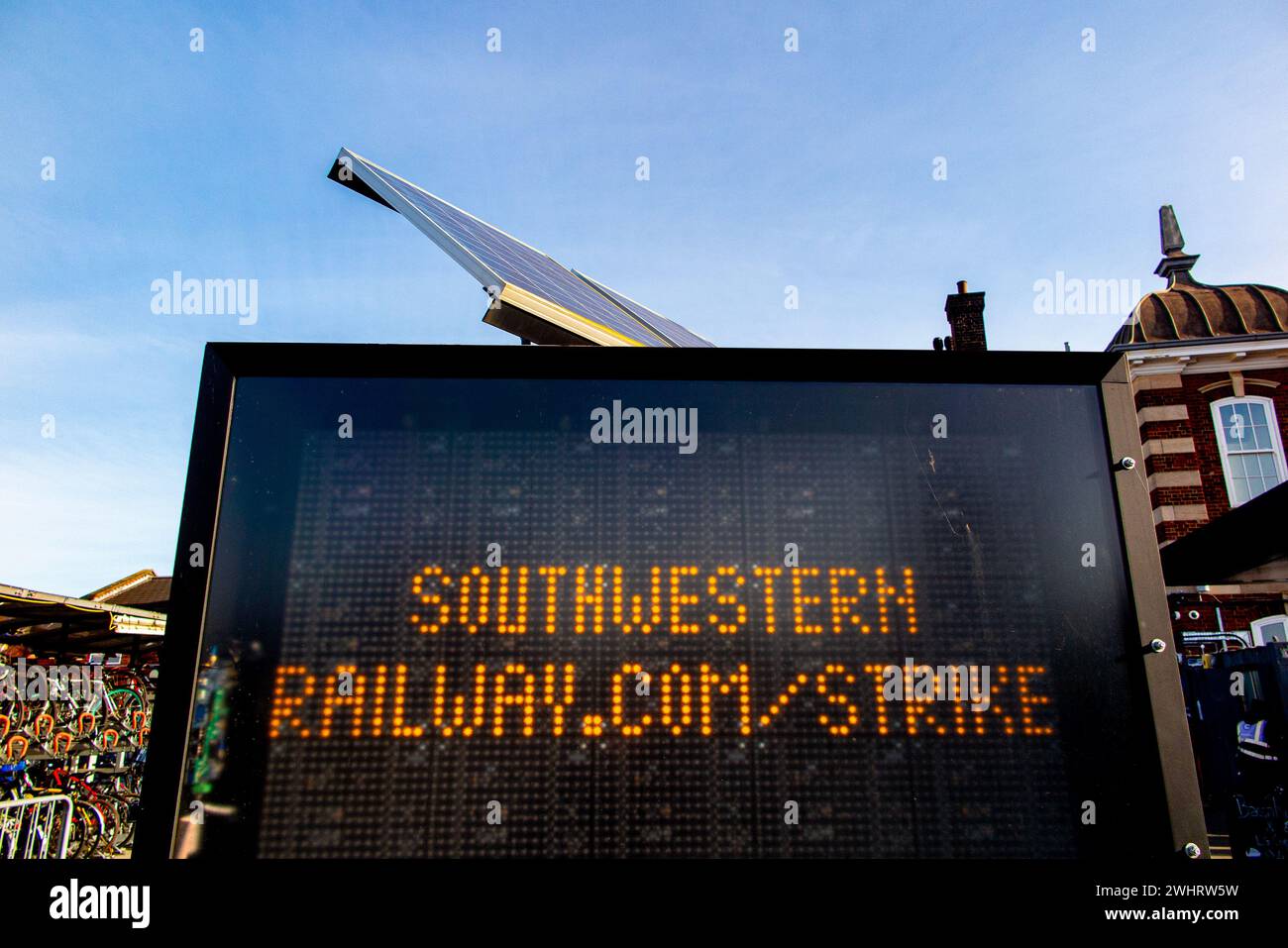 A notice board at Clapham Junction warns of a revised train timetable ...