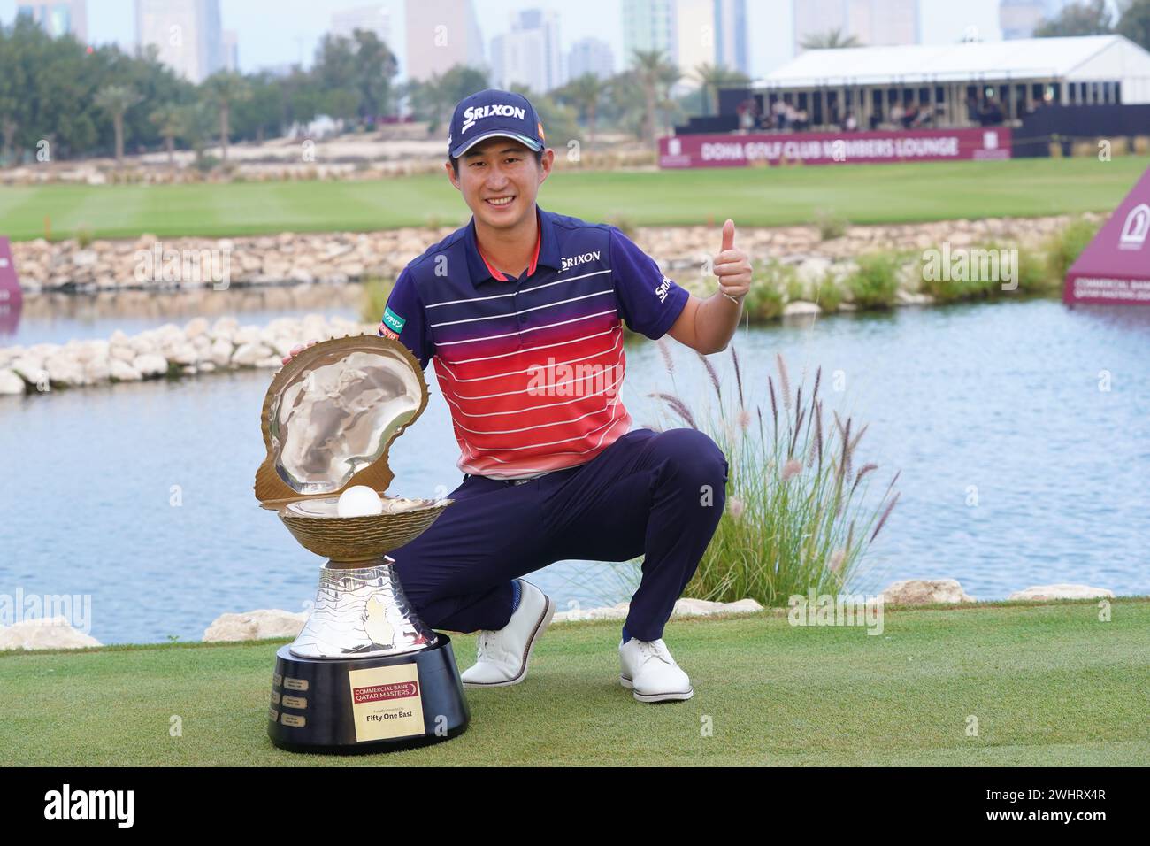 Japan’s Rikuya Hoshino poses with the Mother of Pearl trophy on winning ...