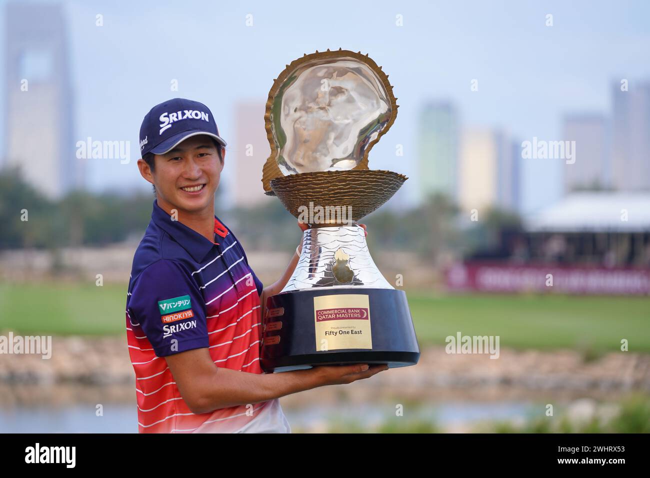 Japan’s Rikuya Hoshino poses with the Mother of Pearl trophy on winning ...