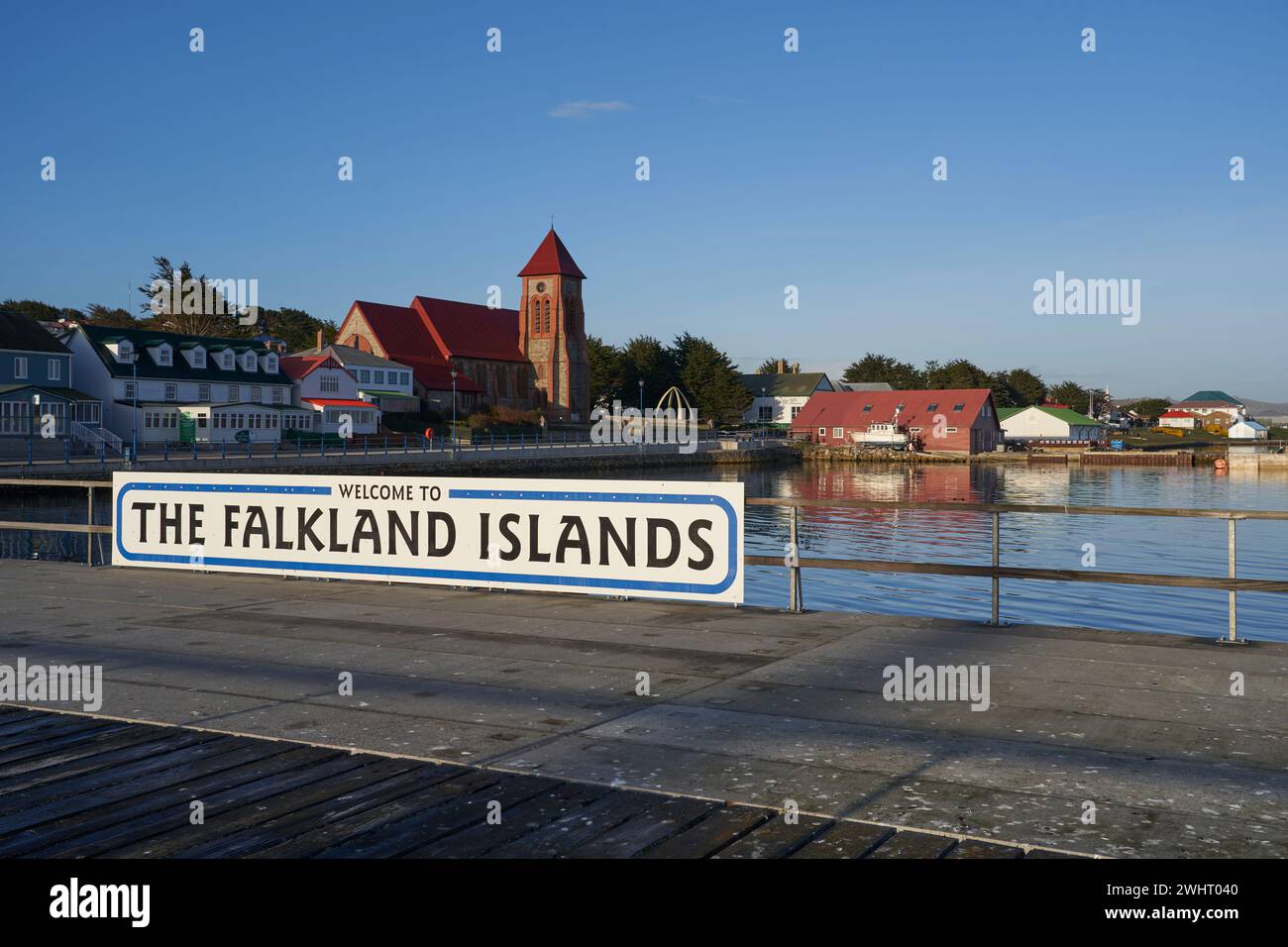 Welcome to the Falkland Islands sign on a jetty used by visitors ...