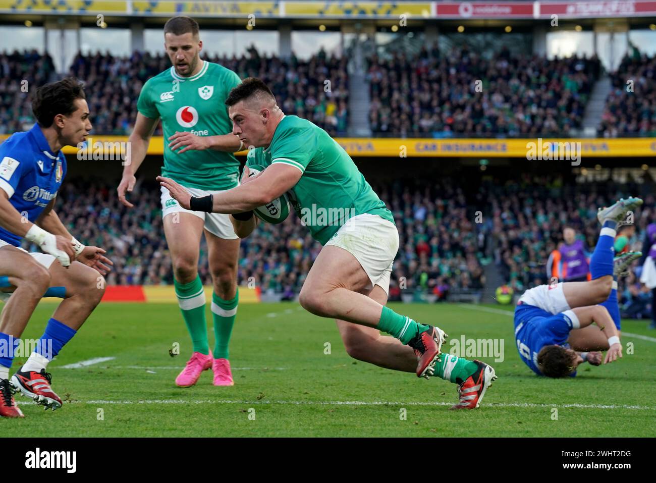 Ireland's Dan Sheehan (right) runs in to score his side second try of ...