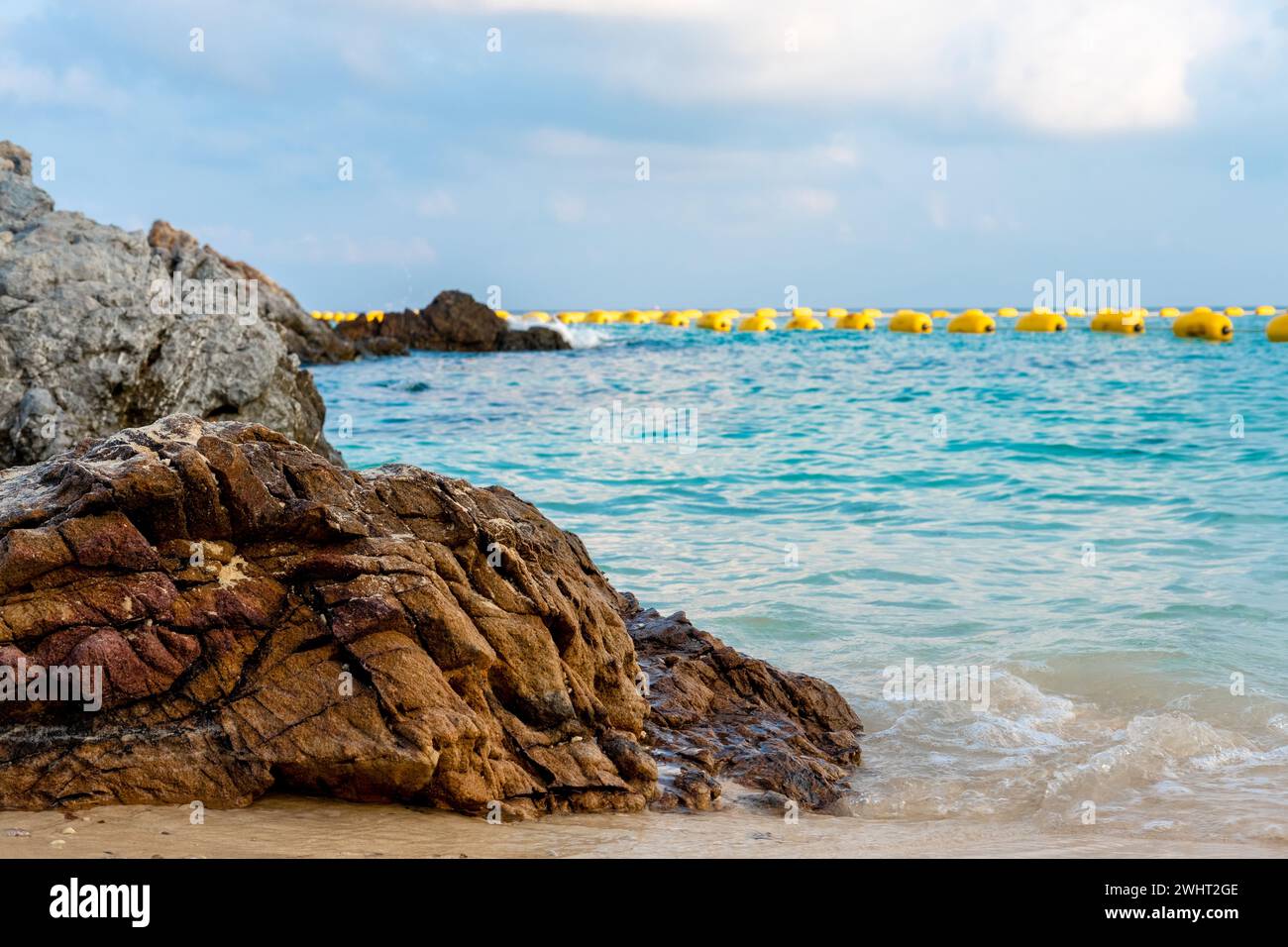 Beautiful views of the beach, sea, rocks during the day with buoys ...