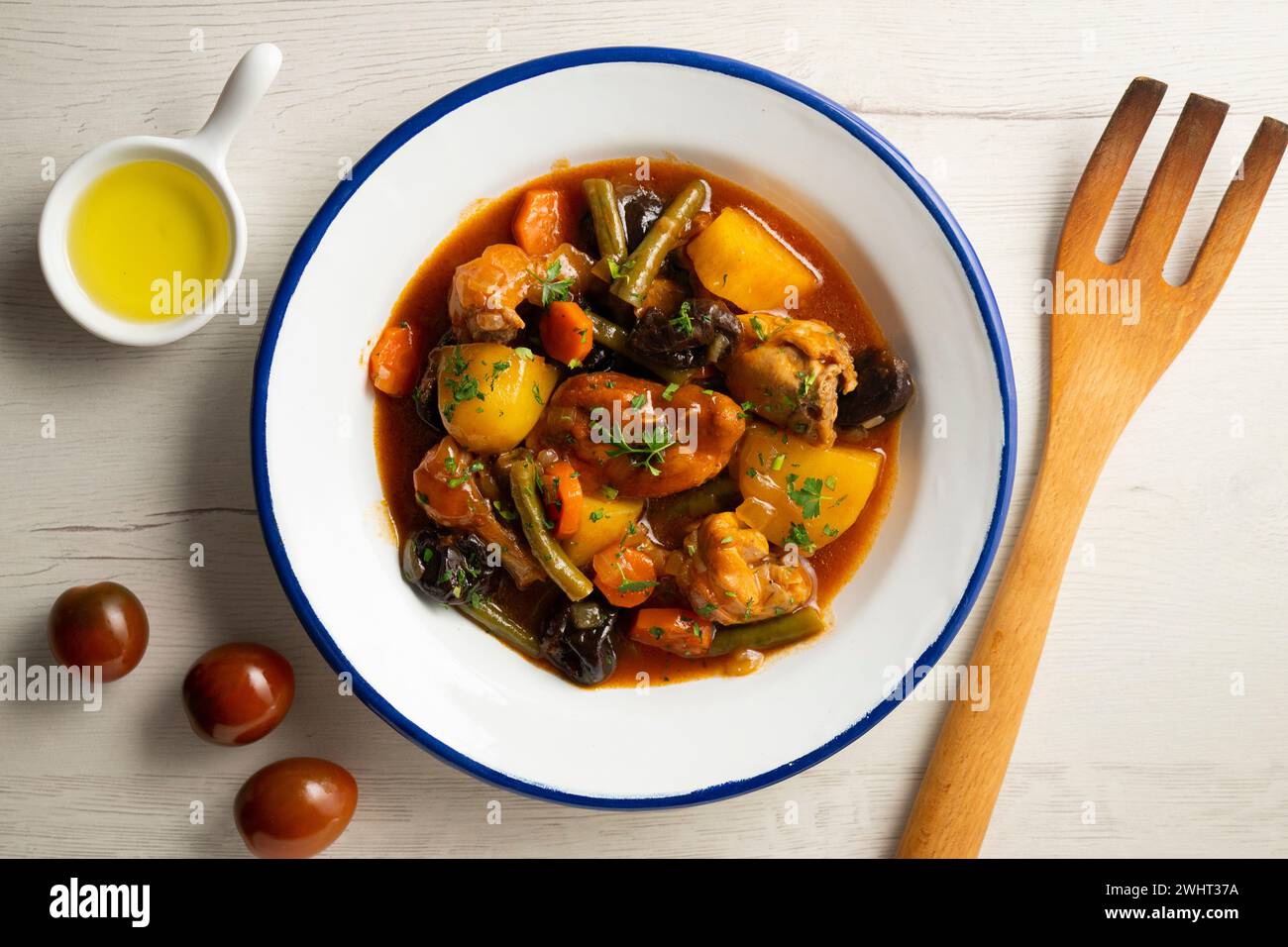 Stewed rabbit with potatoes, green beans, carrots and tomato Stock ...