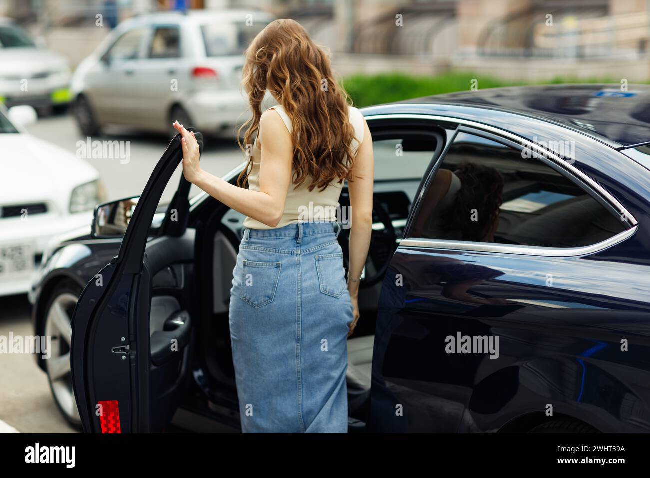 Happy woman driver at car smiling. Cute young happy brunette female ...
