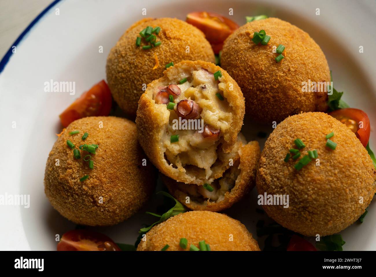 Spanish croquettes made with bechamel sauce and stuffed with octopus ...
