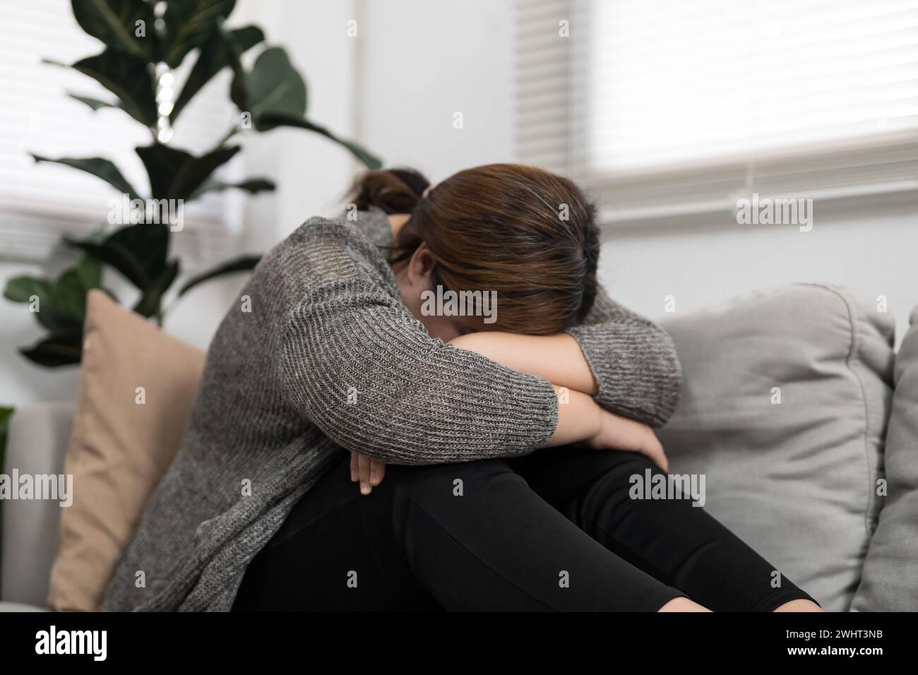 Sad Overweight plus size woman thinking about problems on sofa upset ...