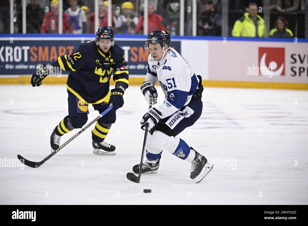KARLSTAD, SWEDEN 20240211Sweden's Tim Heed and Finland's Juha Jääskä during Sunday's ice hockey ...