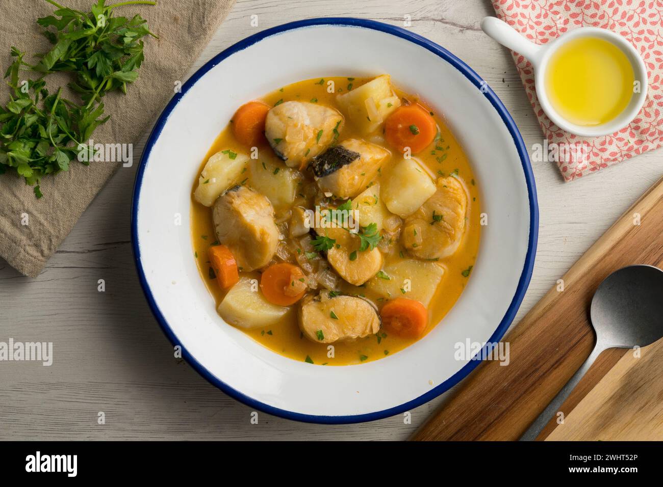 Hake stew with potatoes and carrots. Traditional Spanish recipe Stock ...