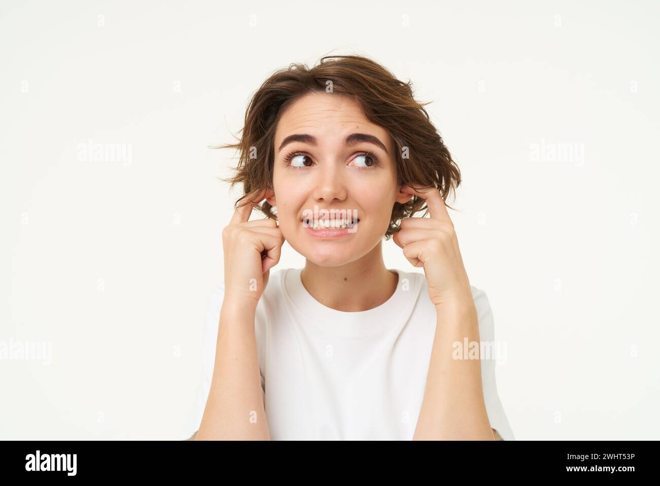 Woman plug ears hi-res stock photography and images - Alamy