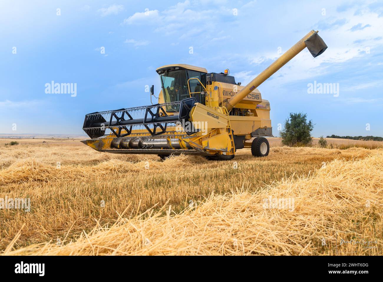 Agricultural machinery carrying out field work during the cereal ...