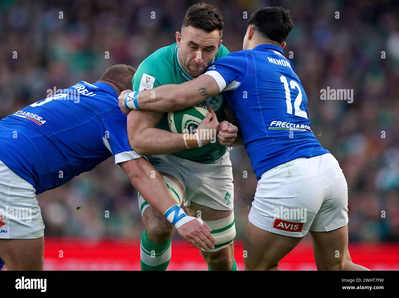 Ireland's Jack Conan (centre) is tackled by Italy's Pietro Ceccarelli ...