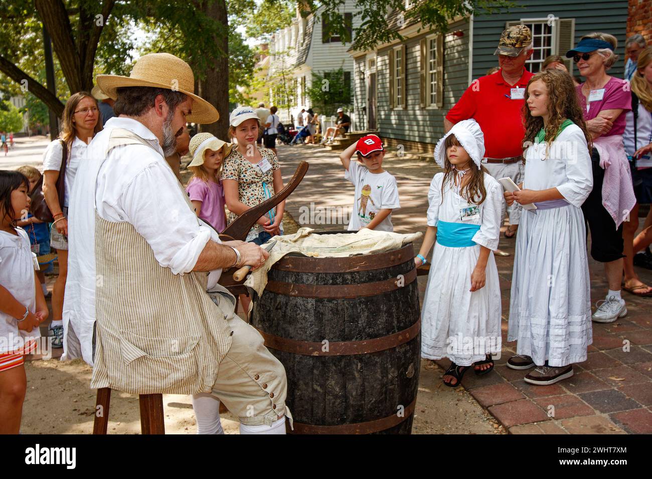 historic interpreter working with leather, man, colonial garb ...