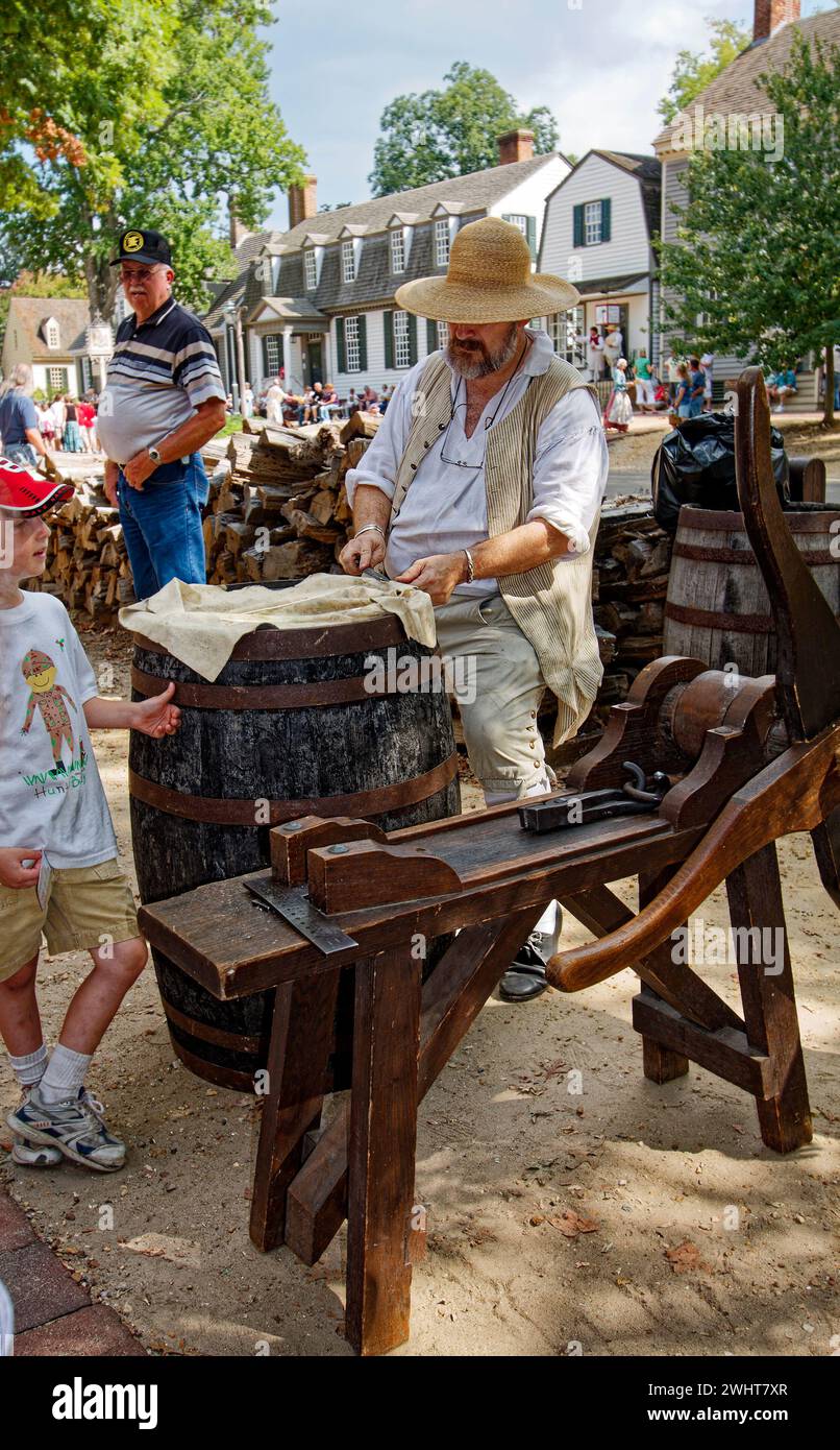 historic interpreter working with leather, man, colonial garb ...