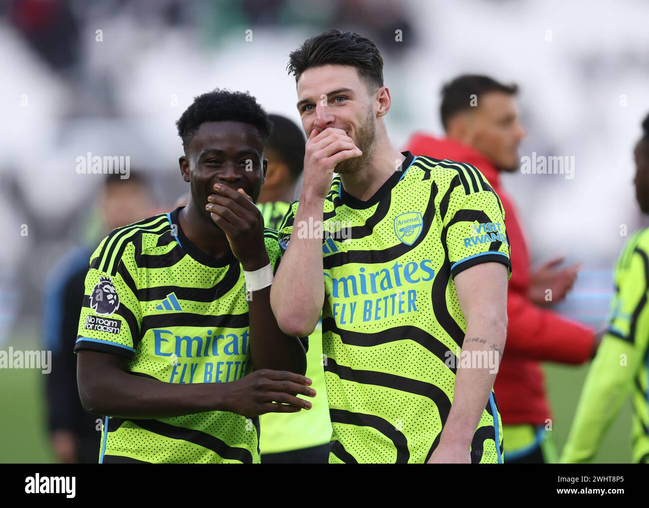 London, UK. 11th Feb, 2024. Bukayo Saka of Arsenal and Declan Rice of ...