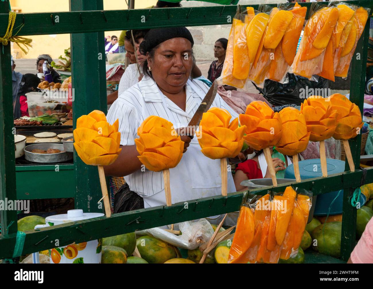 Antigua, Guatemala. Vendor Selling Fresh Mangoes on a Stick Stock Photo ...