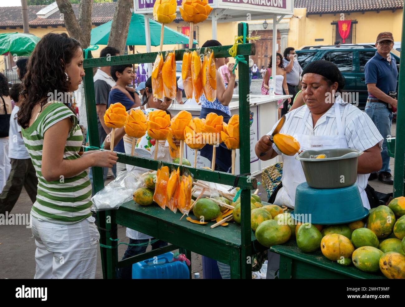 Antigua, Guatemala. Vendor Selling Fresh Mangoes on a Stick Stock Photo ...