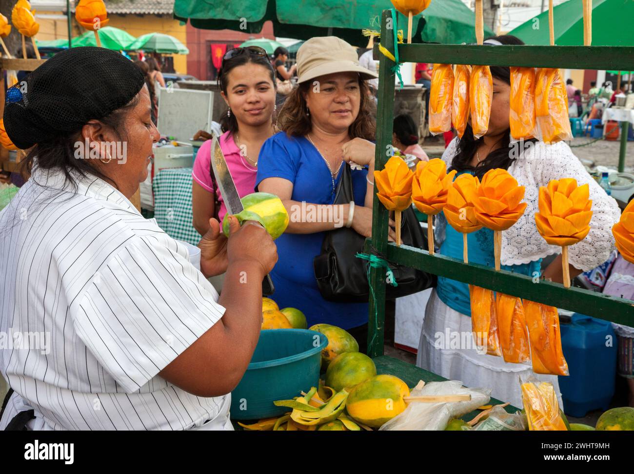 Antigua, Guatemala. Vendor Selling Fresh Mangoes on a Stick Stock Photo ...