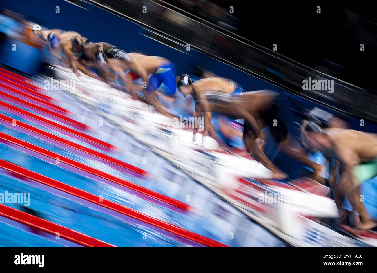 DOHA - Swimmers in action in the men's 50 butterfly during the World ...