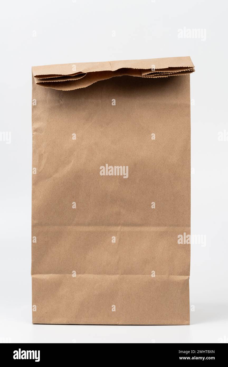 Shopping brown paper bag front view isolated on white studio background ...