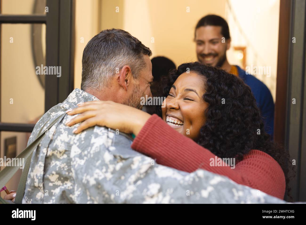 Male welcoming friend home hi-res stock photography and images - Alamy
