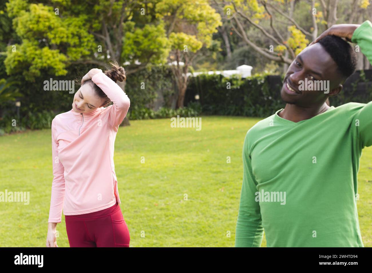 Happy diverse couple practicing yoga hi-res stock photography and ...