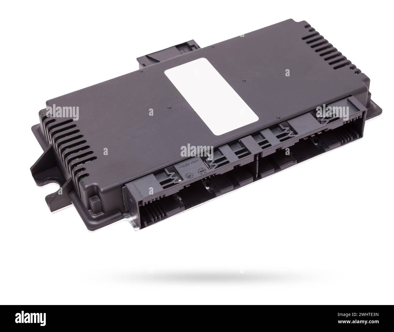Metallic car engine control unit with plastic elements on a white ...