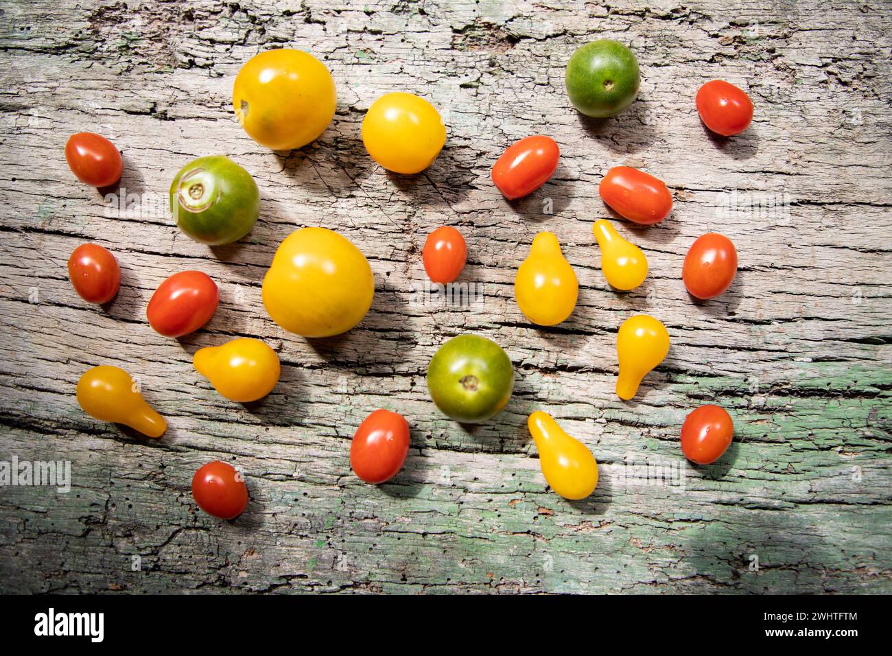 Red, yellow and green cherry tomatoes Stock Photo - Alamy