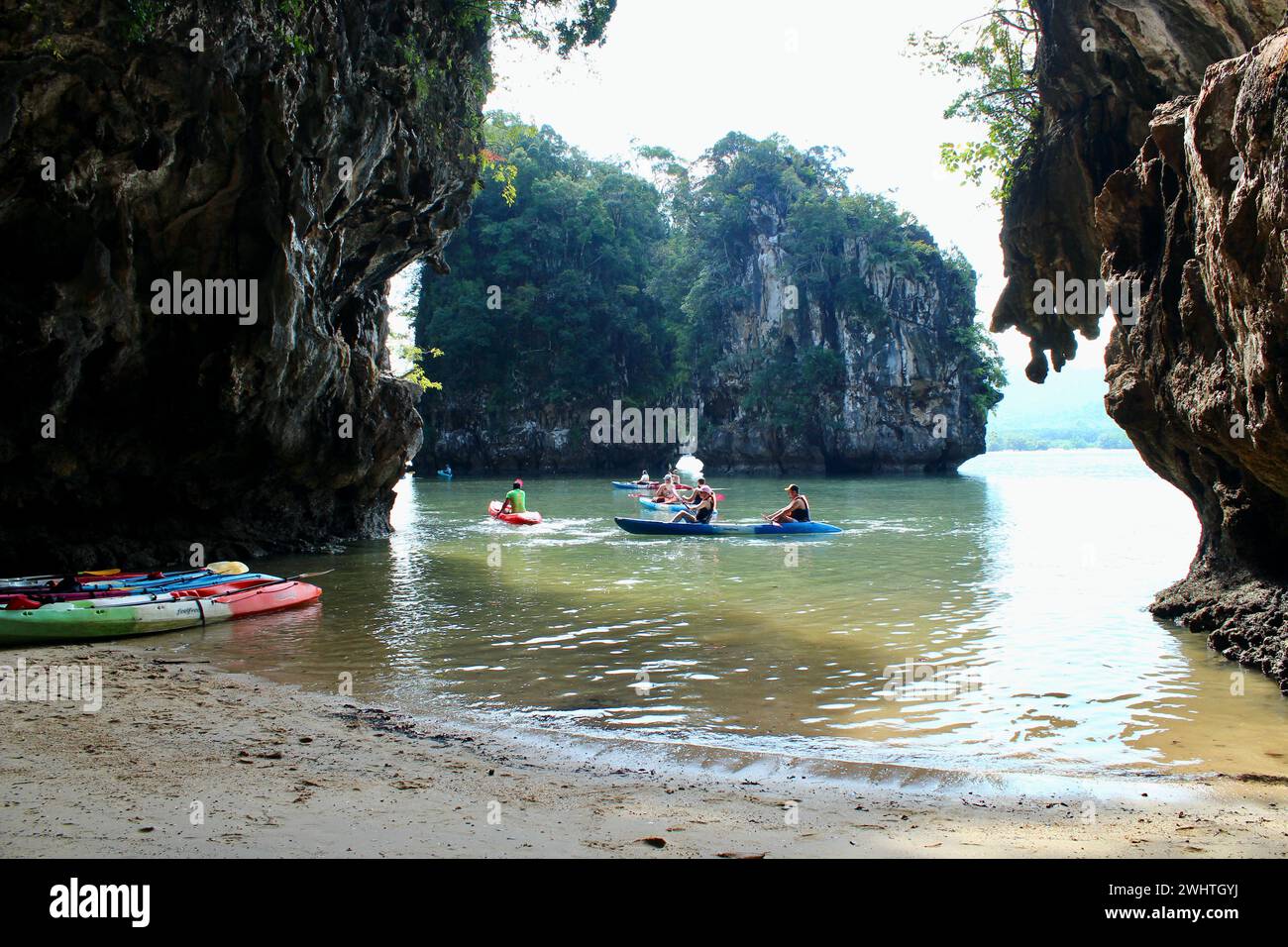 Small beach surrounded by limestone cliff accessible only by water ...
