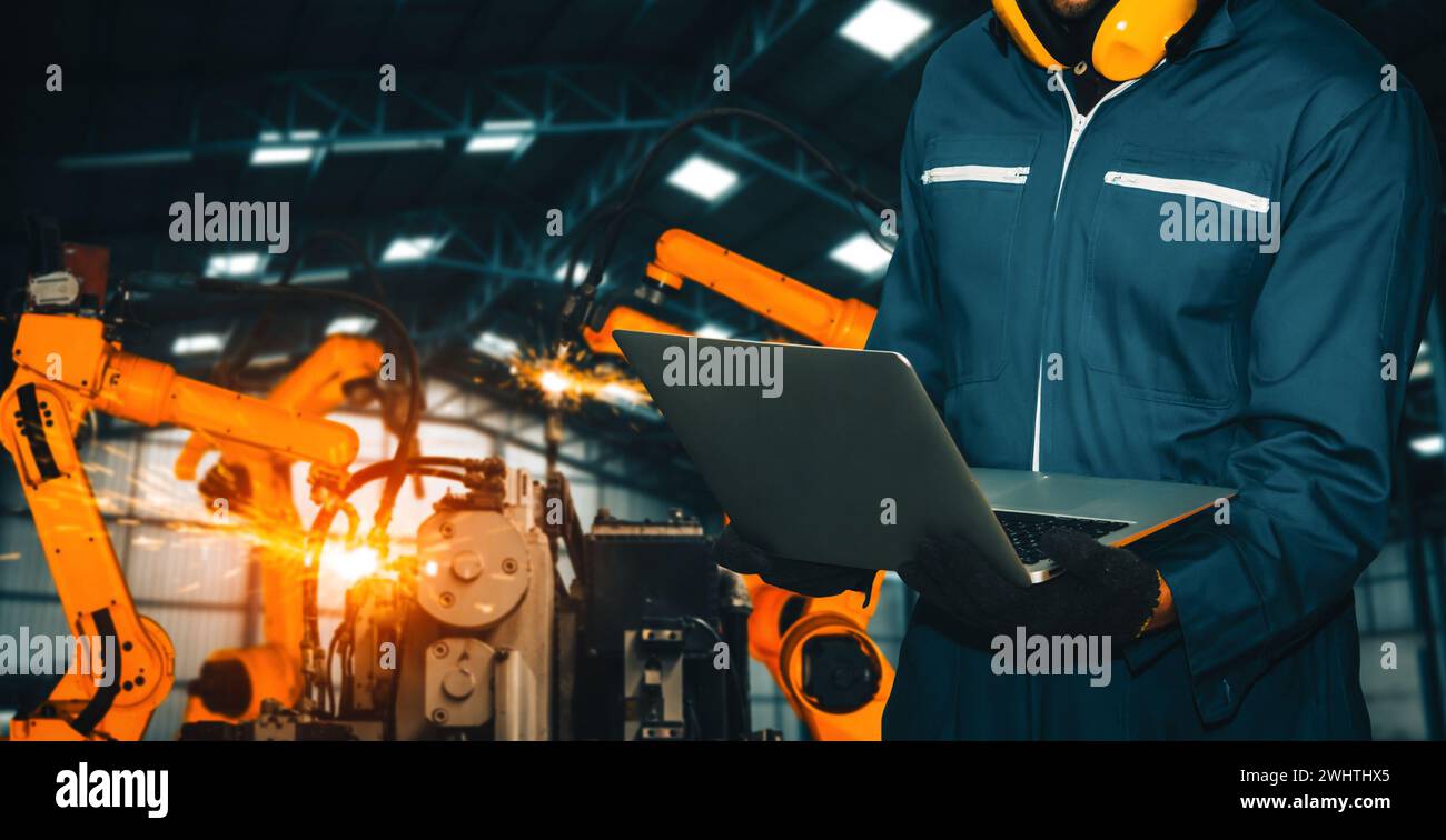 XAI Engineer use advanced robotic software to control industry robot ...