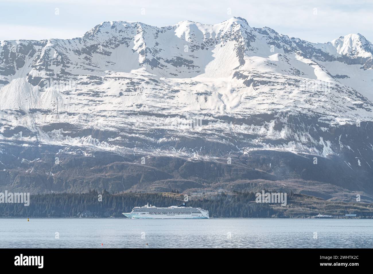 Norwegian Spirit Cruise Liner dwarfed by snow capped mountains behind ...