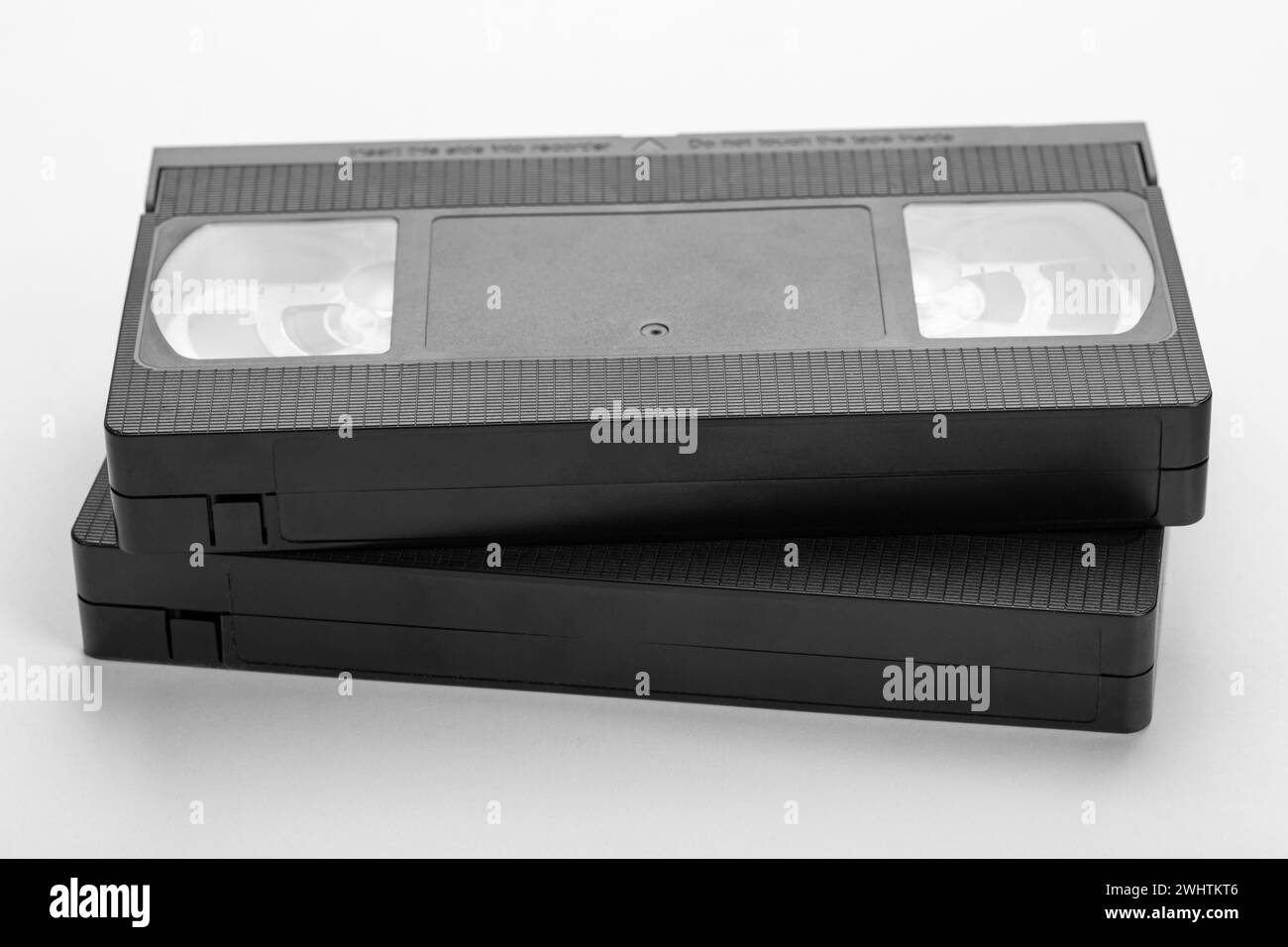 Two videotapes VHS on white background. Vintage media Stock Photo - Alamy